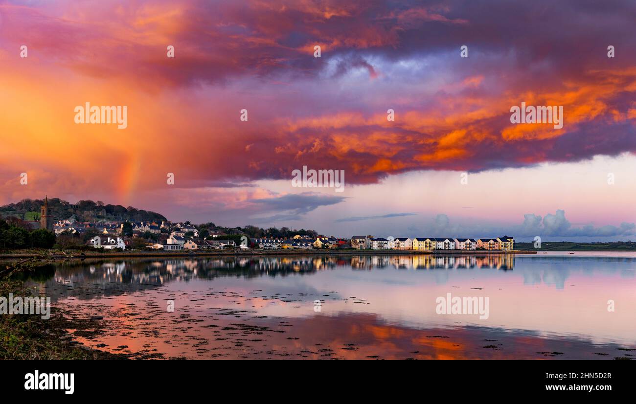 Sunset and a rainbow at Dundrum, County Down, Northern Ireland Stock ...