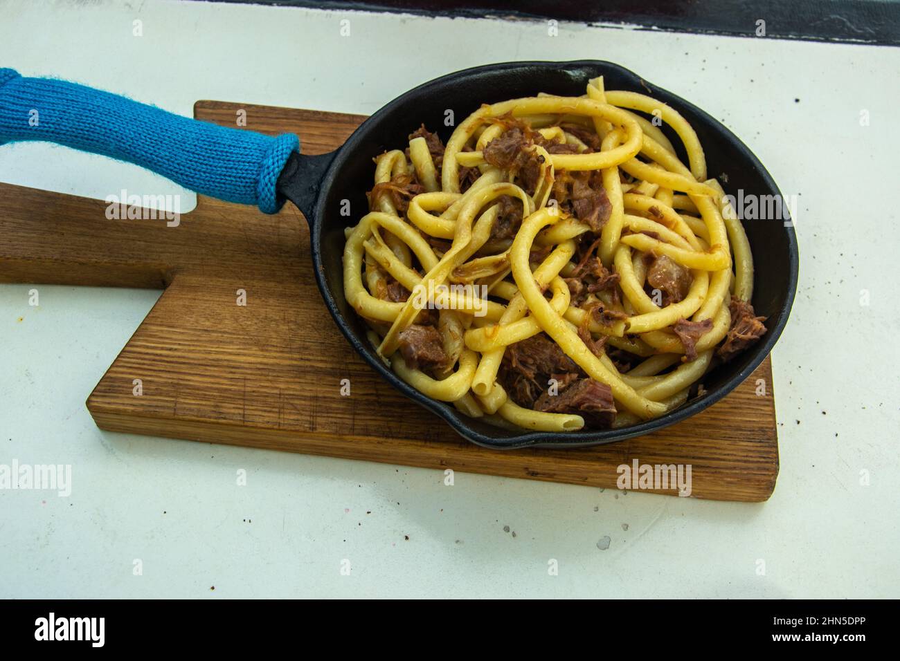 Russian 'Makarony po-flotski' (navy-style pasta) made of cooked pasta ...