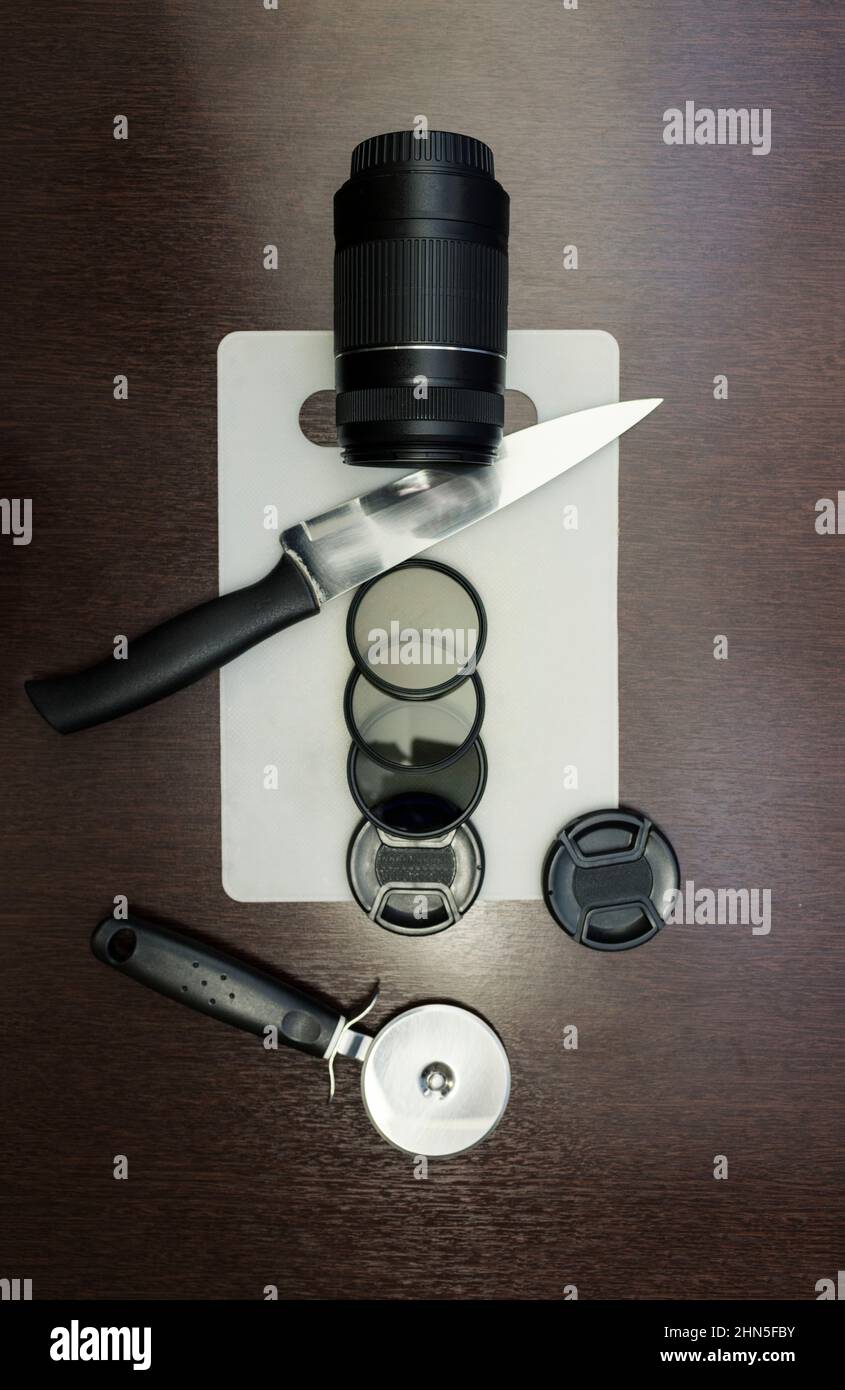Cutting photo lenses on wooden table. Creative photographer concept ...