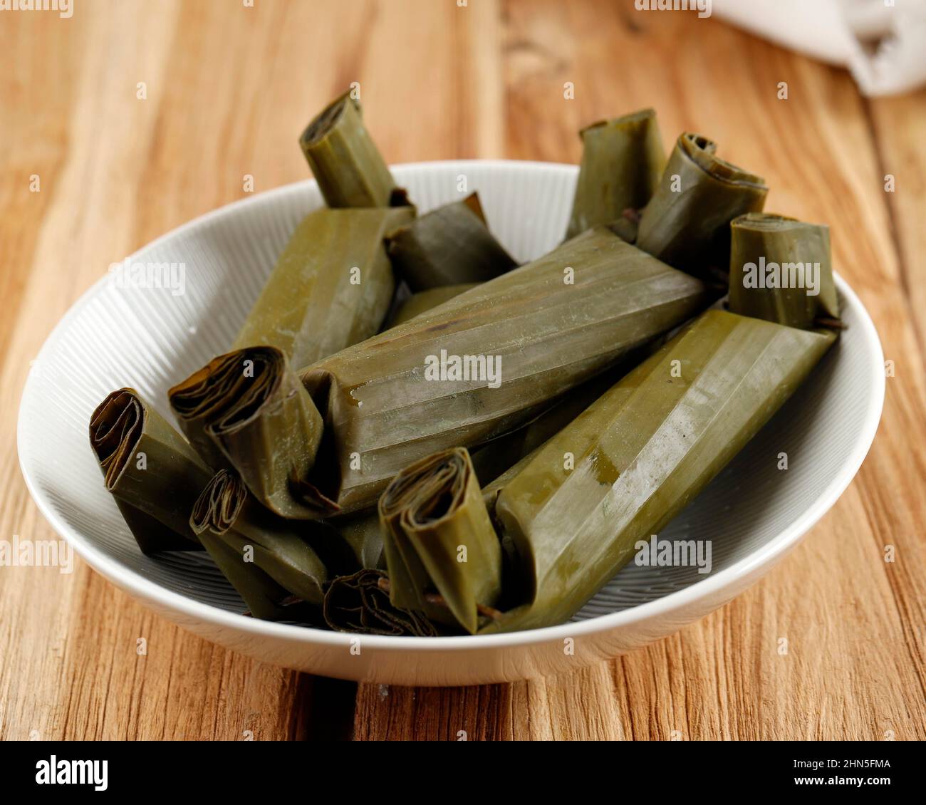 Lontong, Indonesian Compressed Rice Cake with Cylinder Shape, Wrapped ...