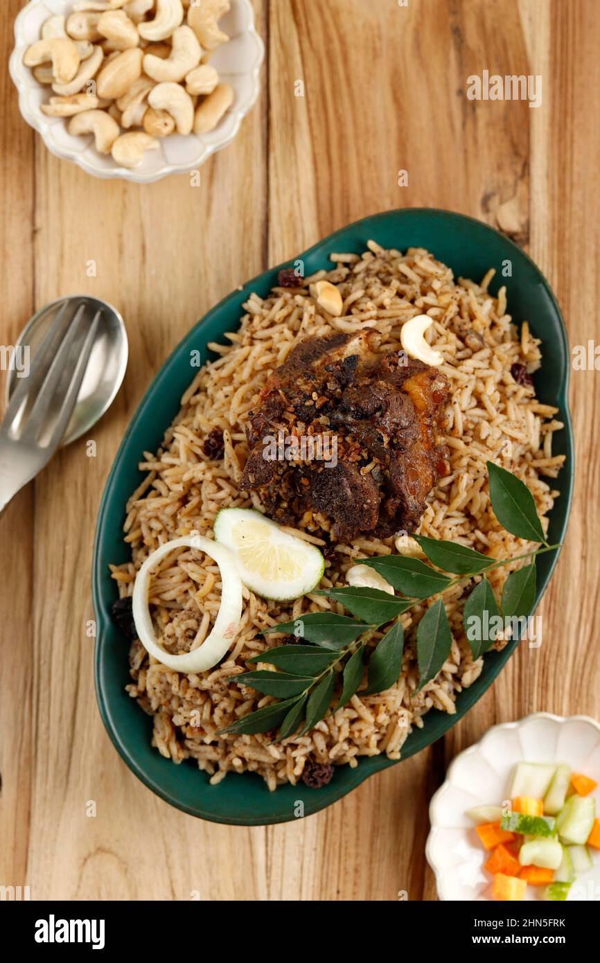 Selective Focus A Plate of Lamb Mandhi Rice Served with Acar, Raisin ...