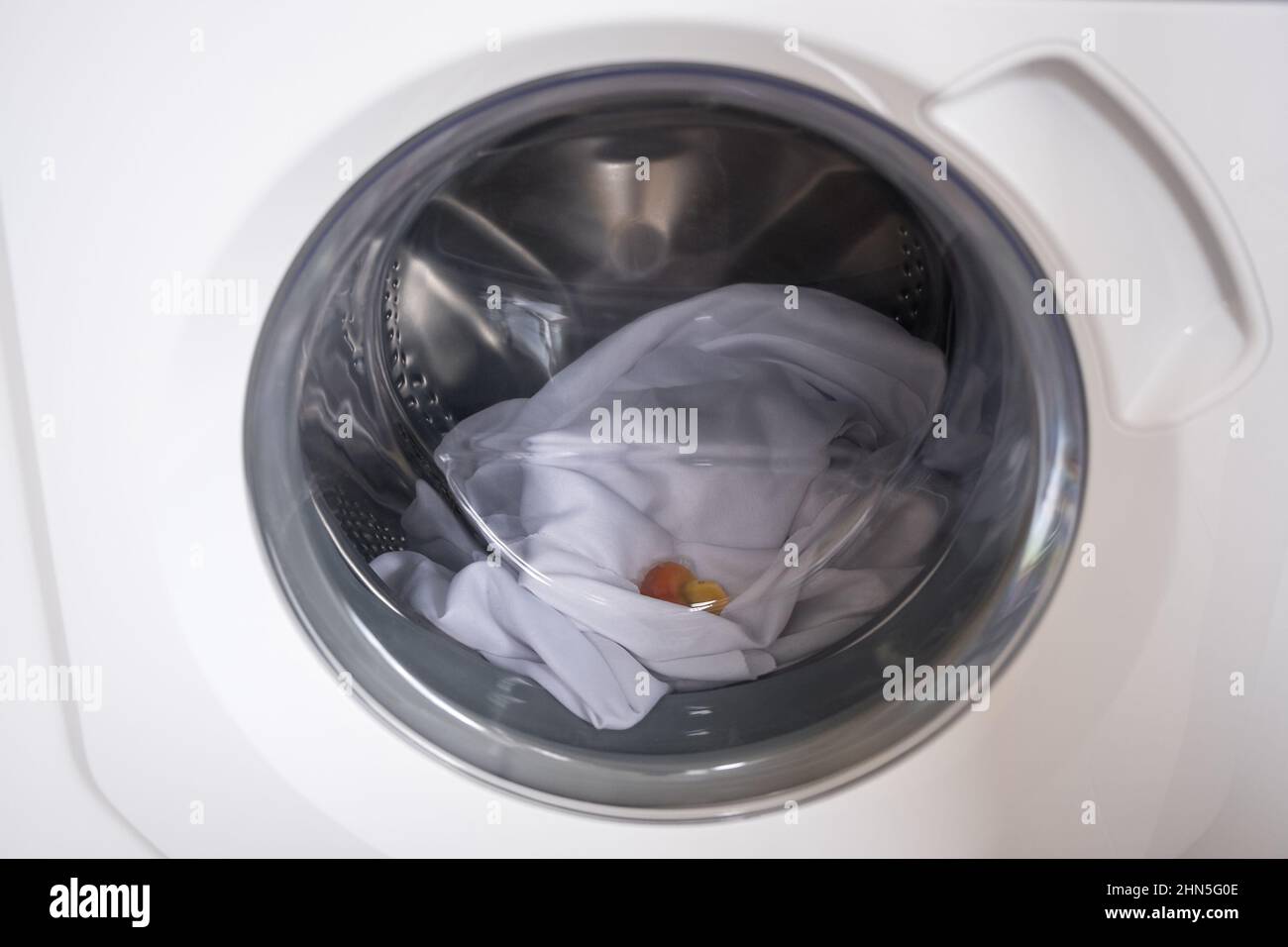 Washing machine with laundry and laundry capsule. Washing clothers ...