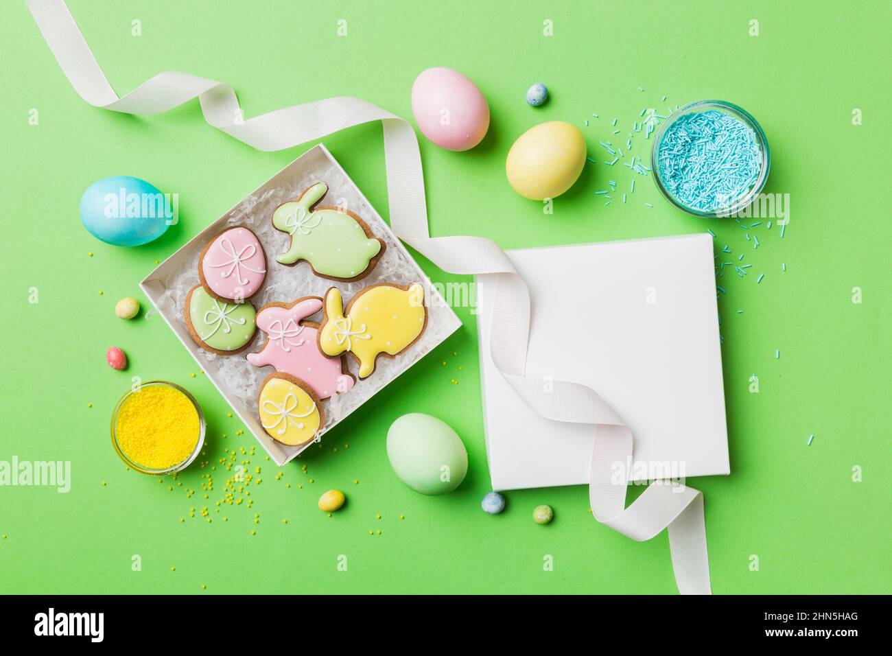 Colorful easter cookies in basket with Multi colors Easter eggs on ...