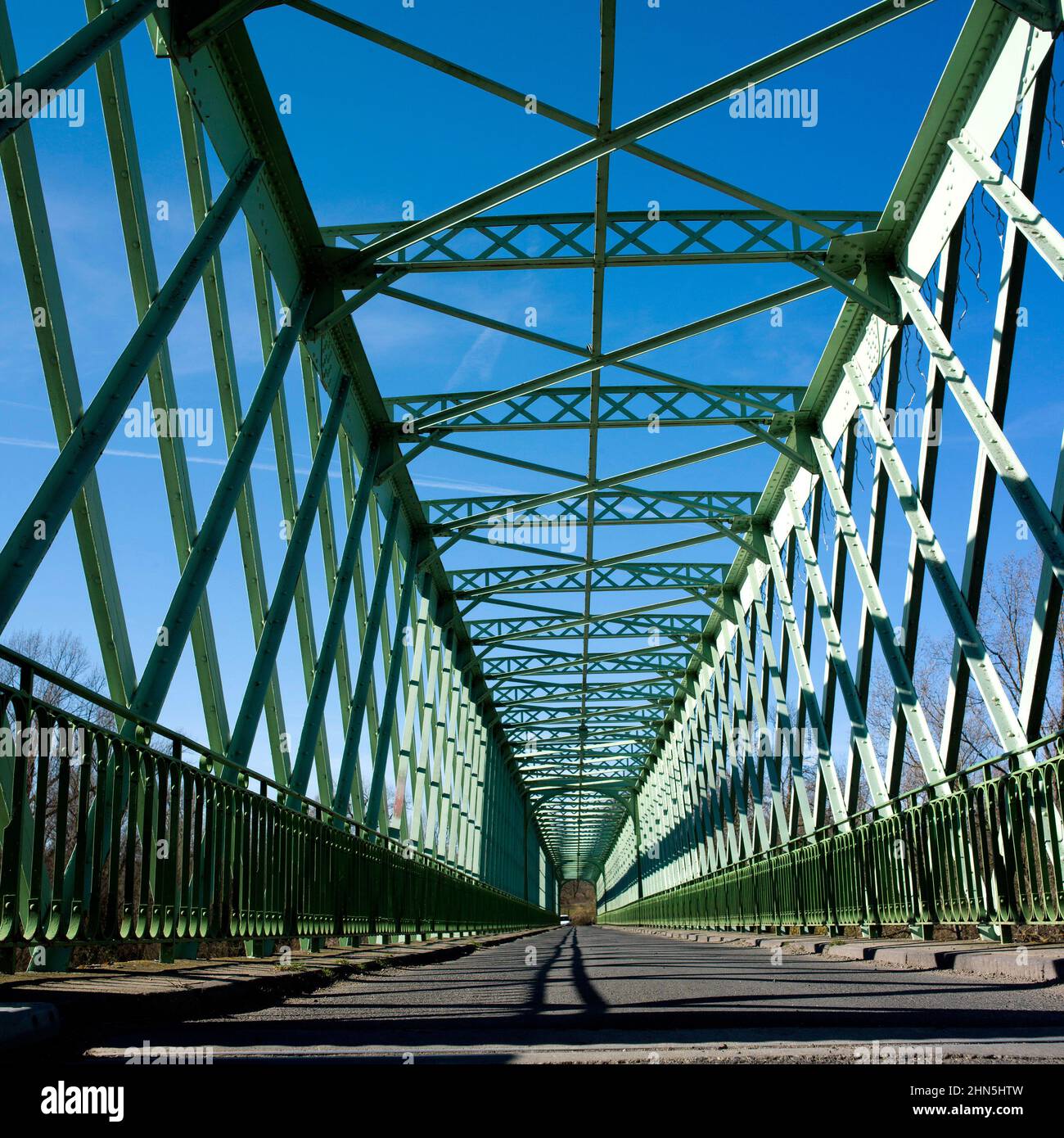 Green metal truss bridgeof Dallet village on river Allier, Puy de Dome ...