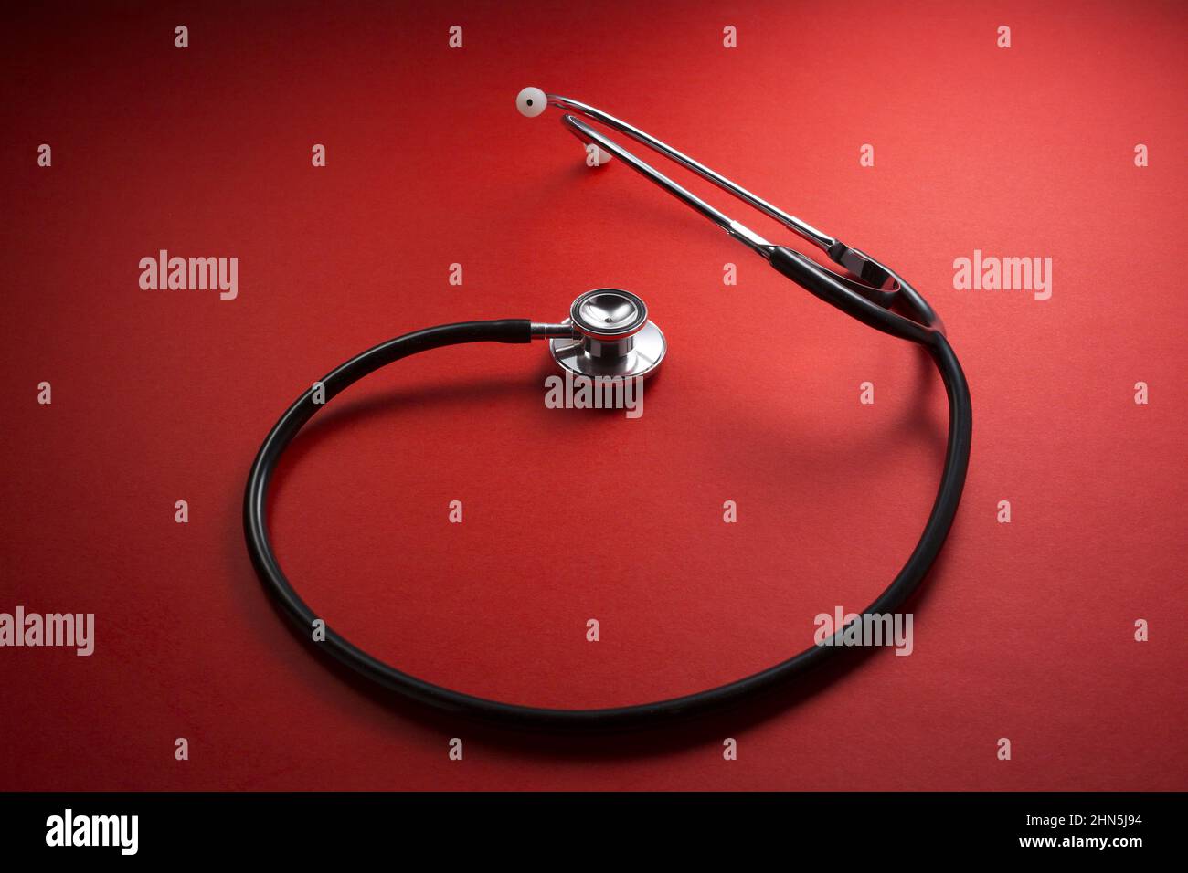 stethoscope in red background Stock Photo - Alamy