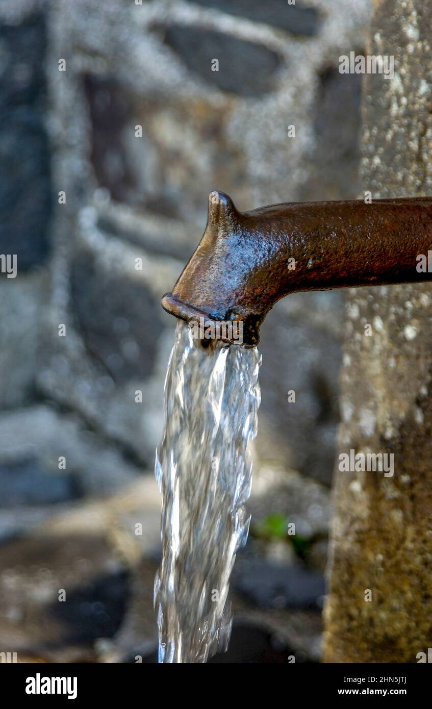 Water flowing from rustic pipe hi-res stock photography and images - Alamy