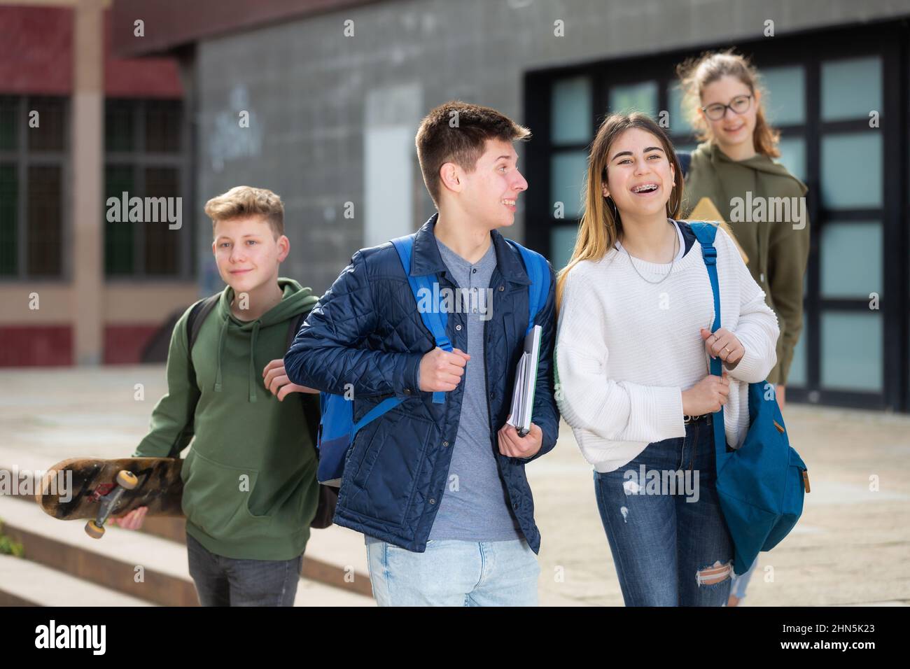 Carefree teen students boy and girl friendly talking Stock Photo - Alamy