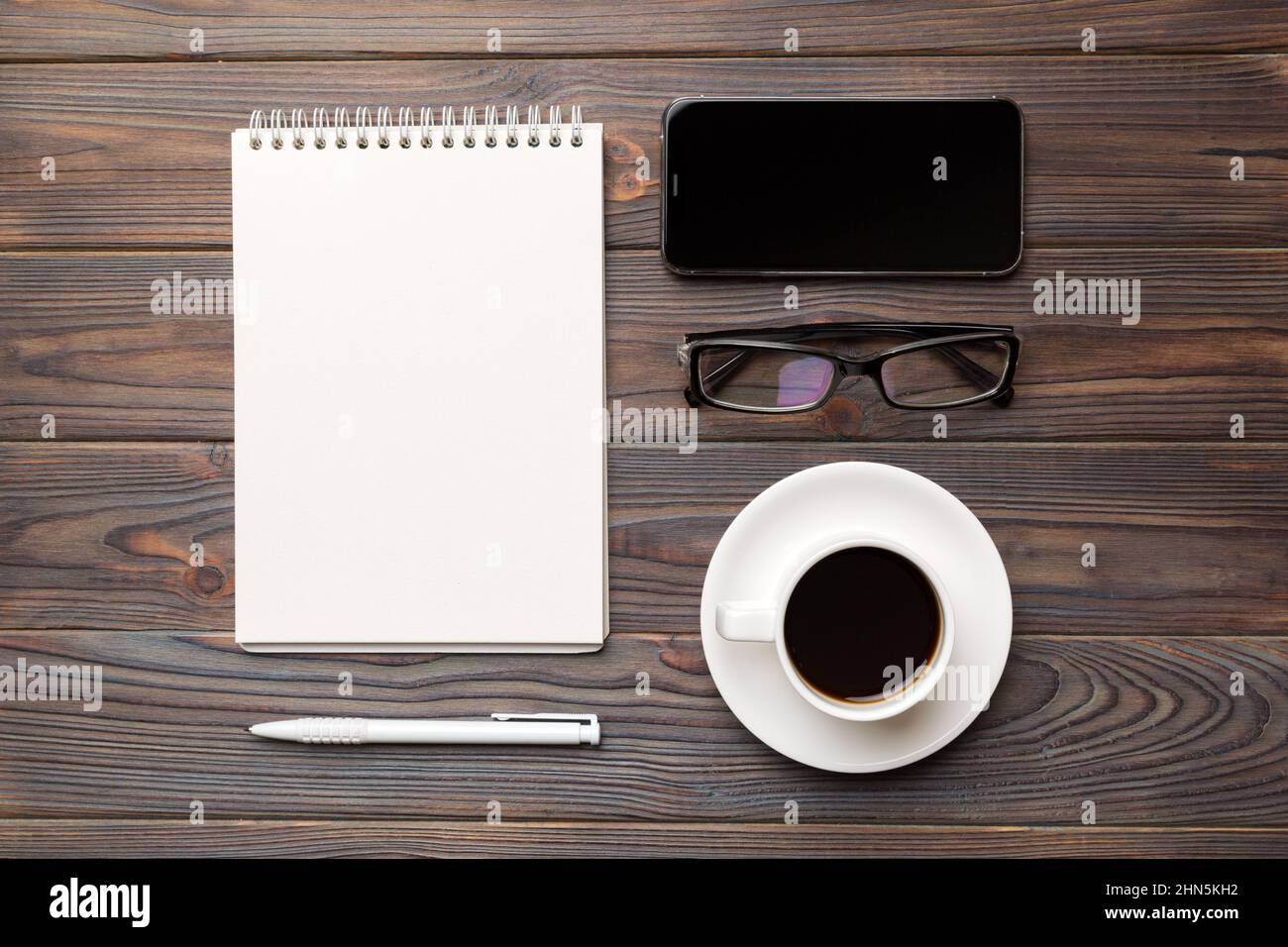 Modern office desk table with notebook, smartphone and other supplies ...