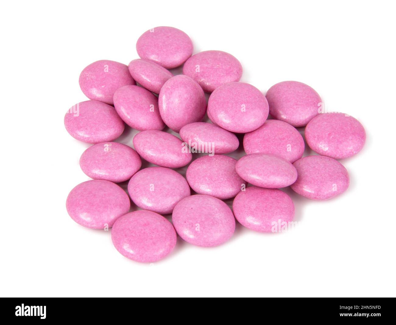 Pink dragee drops chocolate glazed isolated on the white background ...