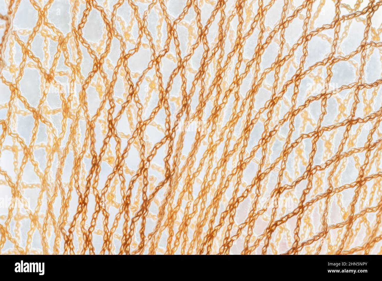 Beige network pattern close-up texture as background Stock Photo - Alamy