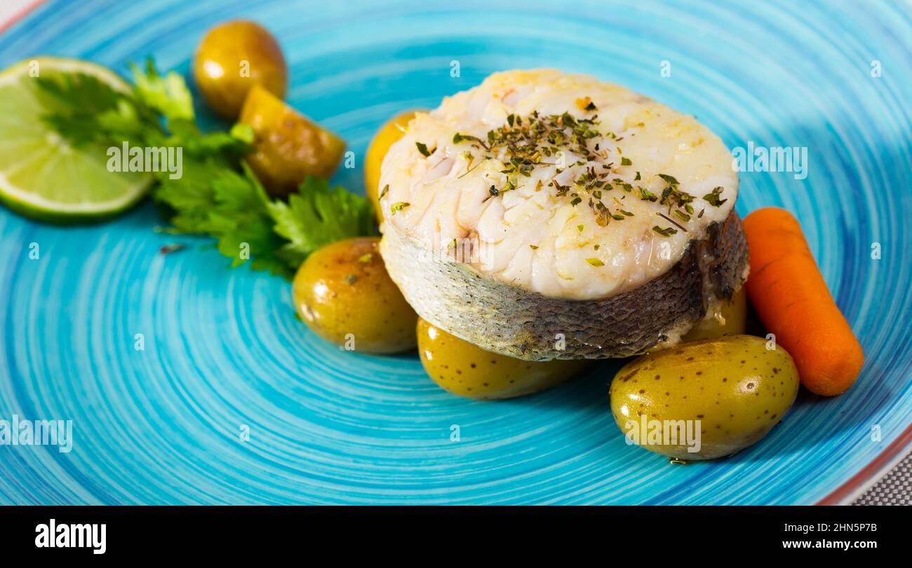 Recipe of rustic style merluccius Stock Photo - Alamy