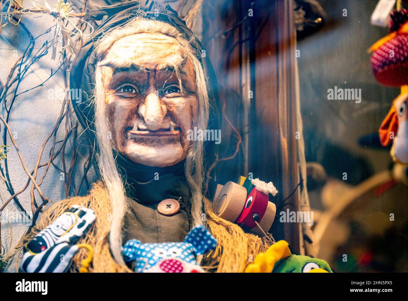 A scary grandmother's doll with a big nose and fangs Stock Photo - Alamy