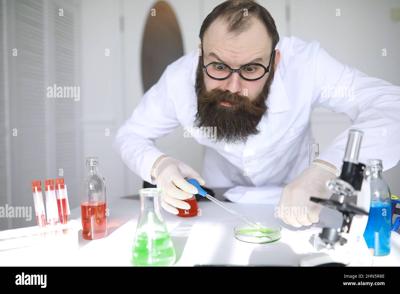 Chemist crazy. A mad scientist conducts experiments in scientific ...