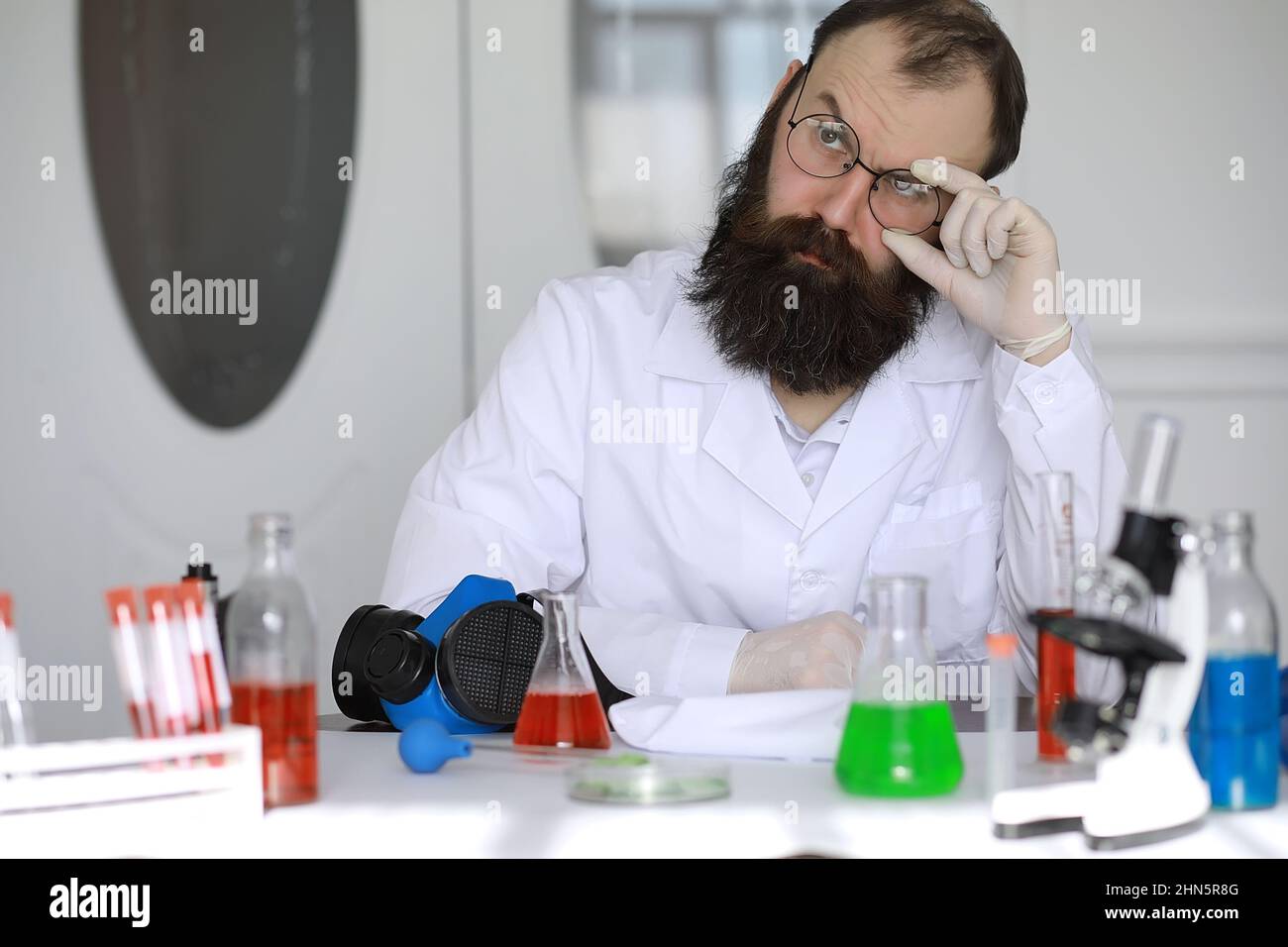 Chemist crazy. A mad scientist conducts experiments in scientific ...