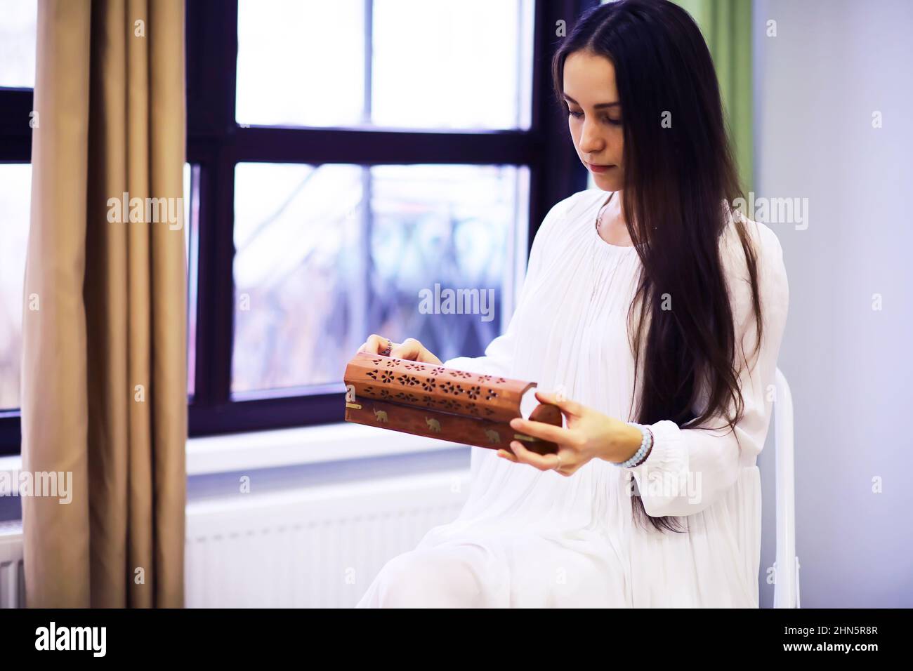 Relaxed serene pretty young woman at home, happy calm lady dream enjoy ...