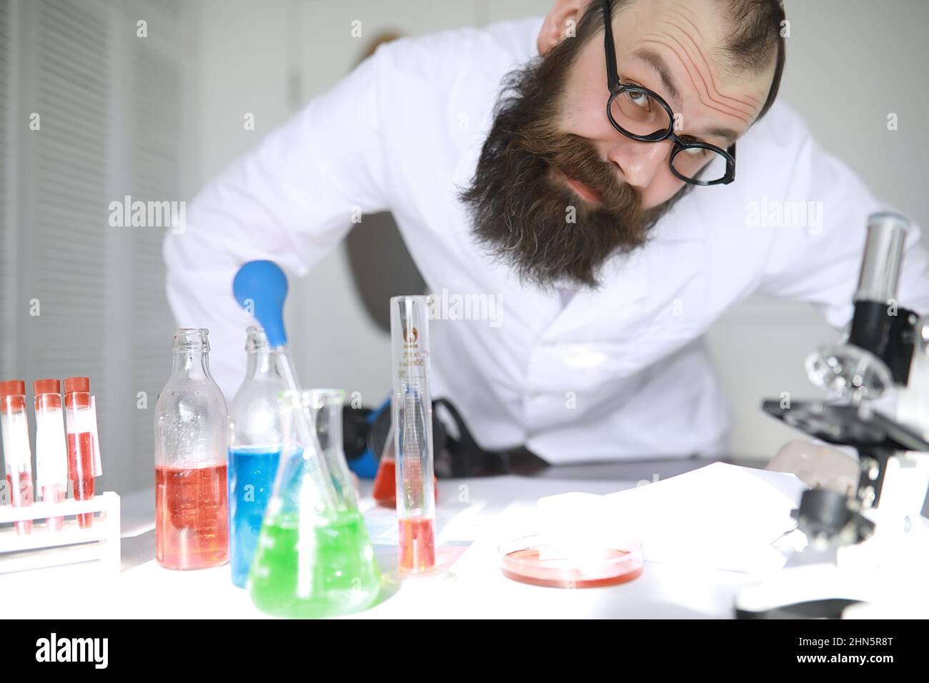 Chemist crazy. A mad scientist conducts experiments in scientific ...