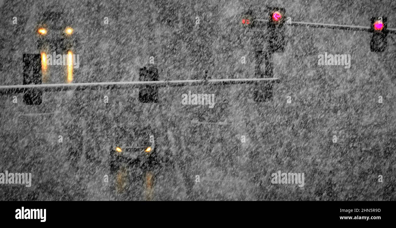 Driving on snow and snowy roads in winter traffic lights blizzard Stock ...