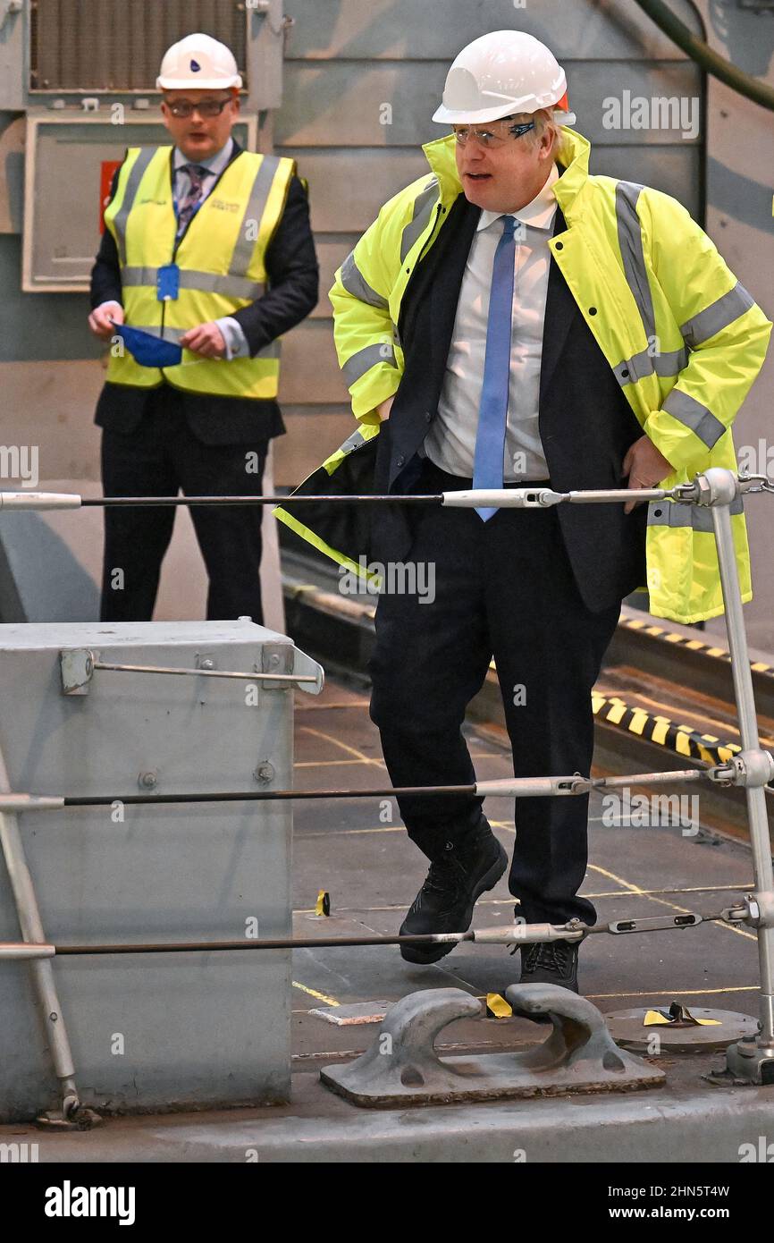 Prime Minister Boris Johnson is shown a vessel undergoing refit for the ...