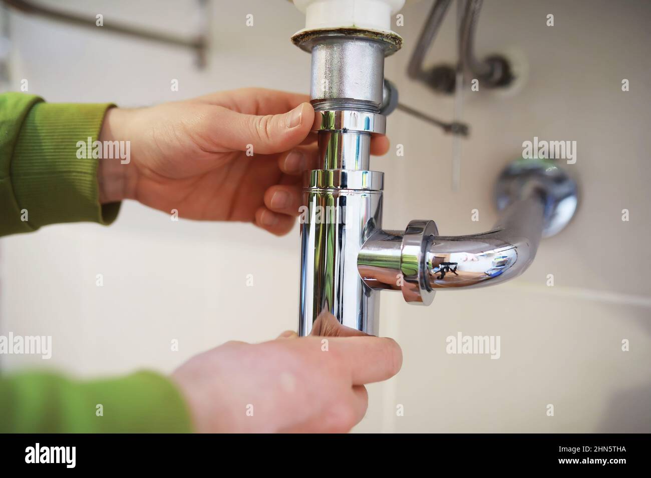 Plumbing repair. Sewer cleaning. Food grinder inspection repair Stock ...