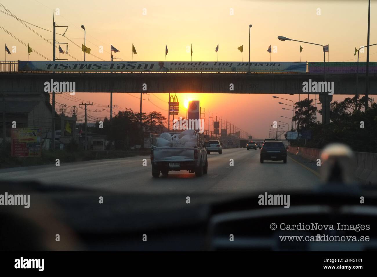 Heading south on Phetkasem Road towards Hua Hin during sunset in ...