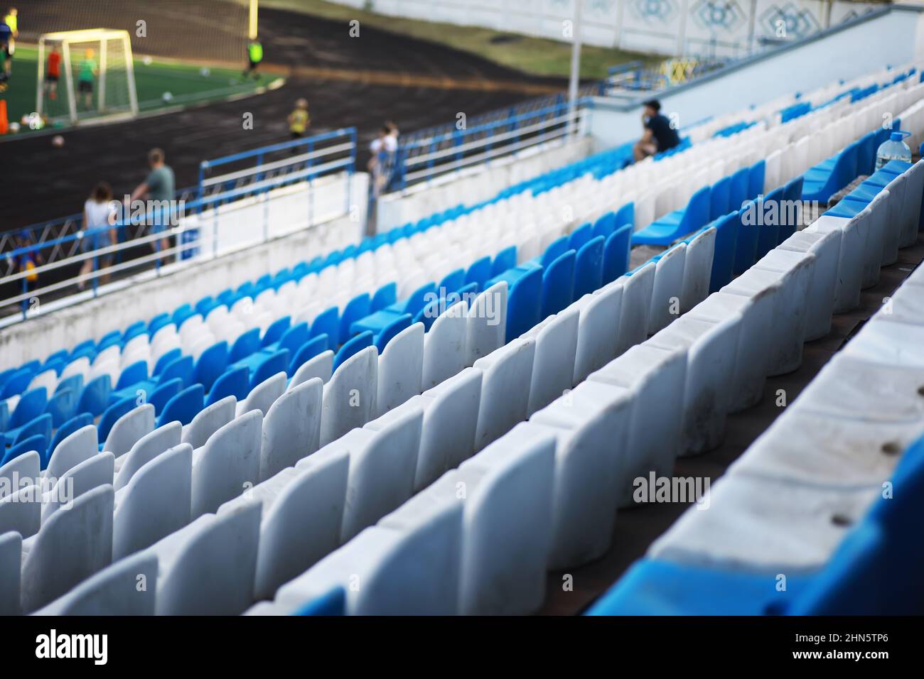 Plastic chairs in the stands of a sports stadium. Cheer on the stands ...