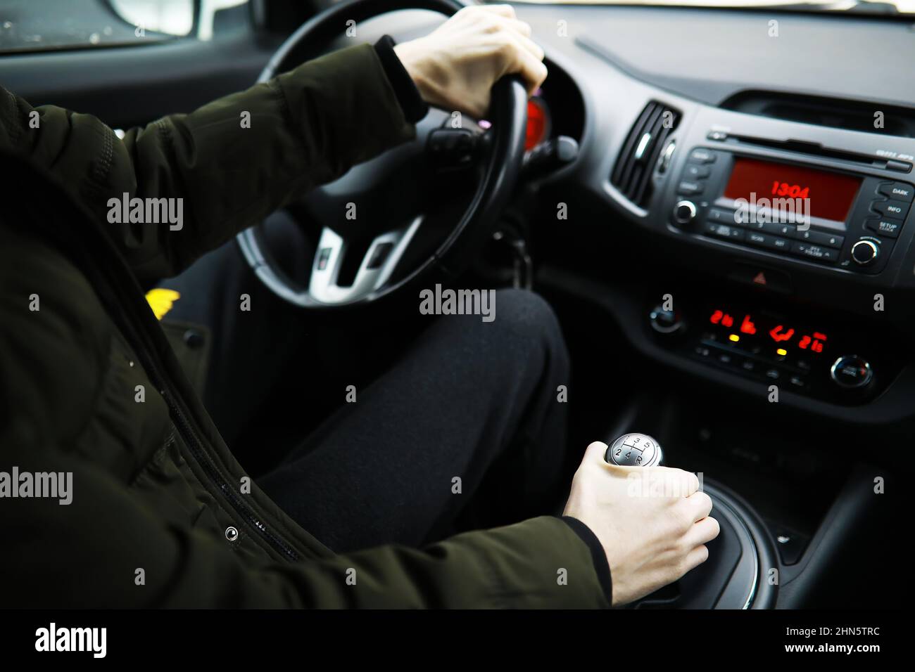 Hand on car gear knob. The driver switches the speed in the car. Hand ...