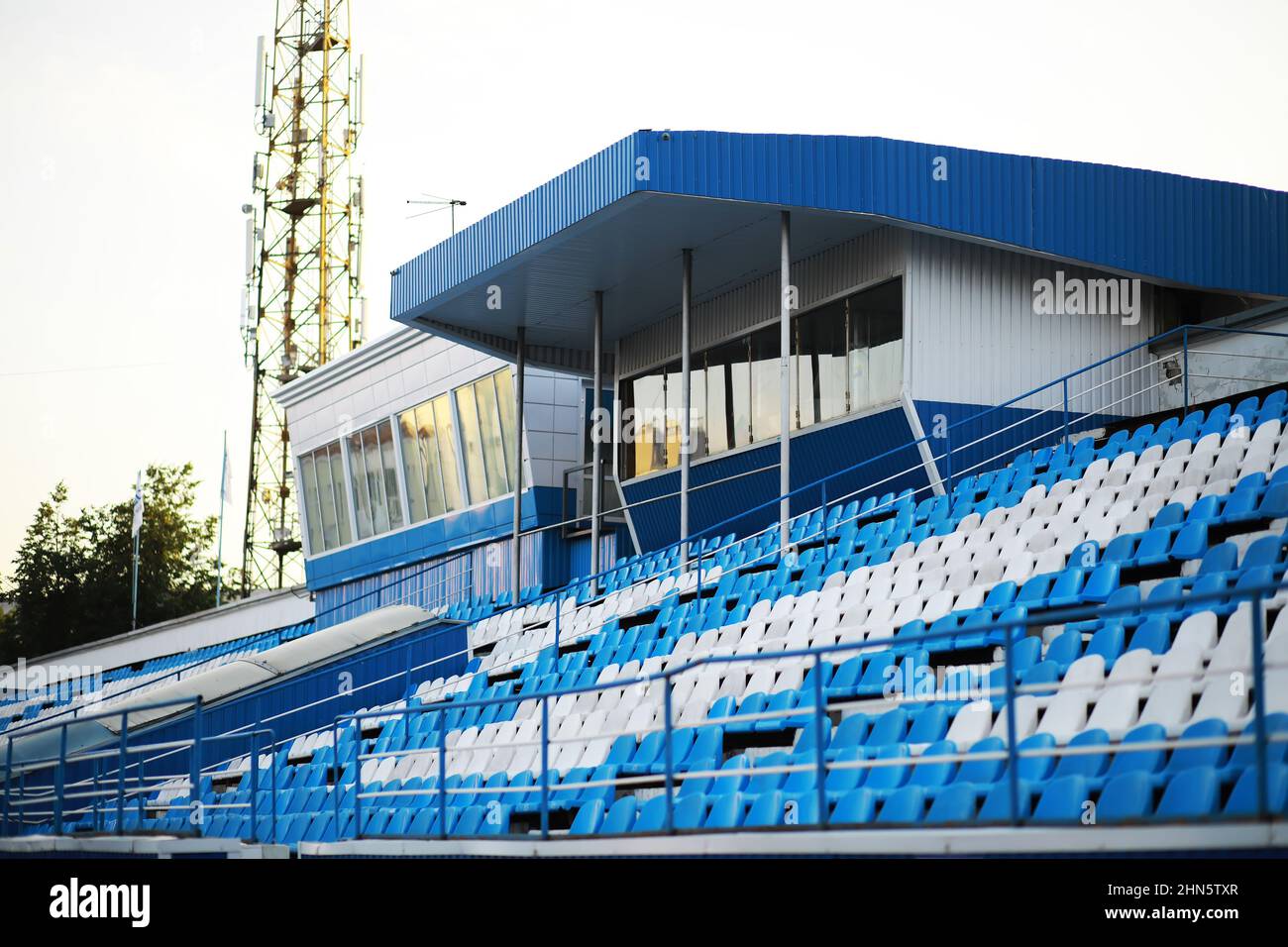 Plastic chairs in the stands of a sports stadium. Cheer on the stands ...