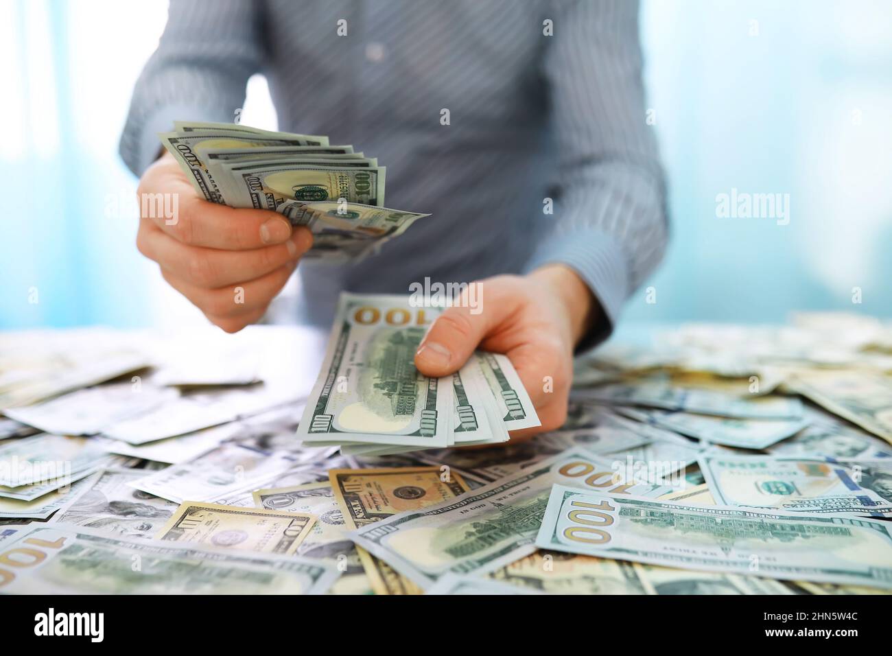 Cash money in a large pile as a finance background. Paper money close ...