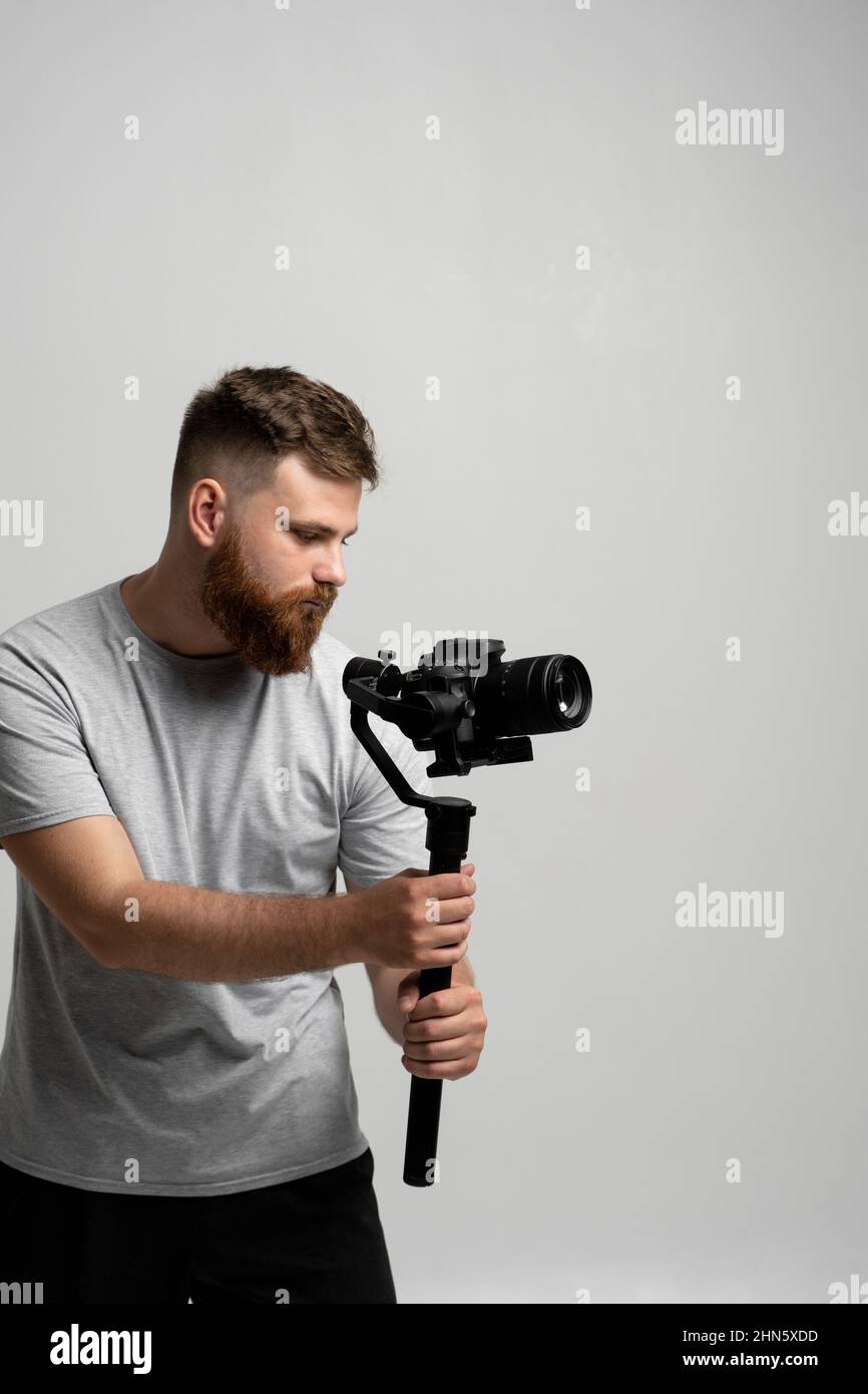Professional male videographer filmmaker cinematographer dop shooting ...