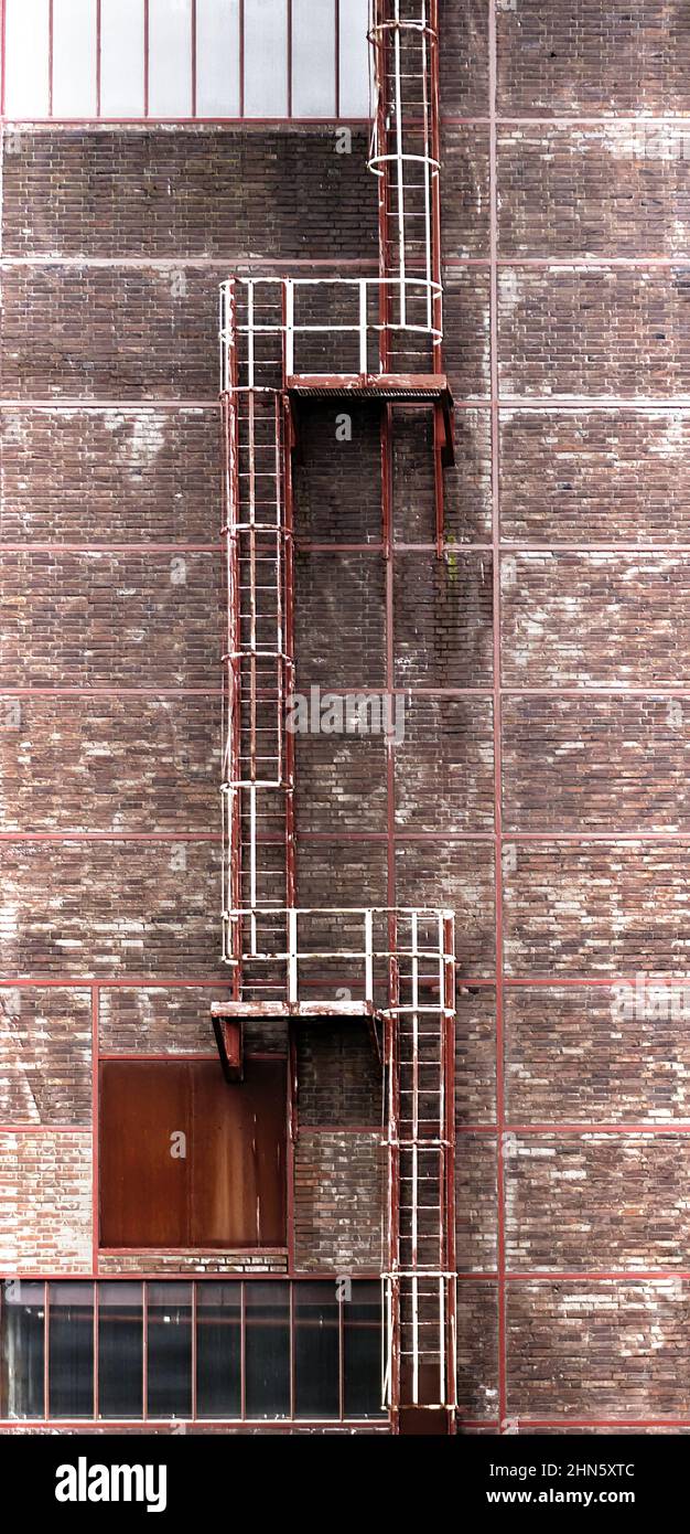 High red and white iron staircase with intermediate platforms of ...
