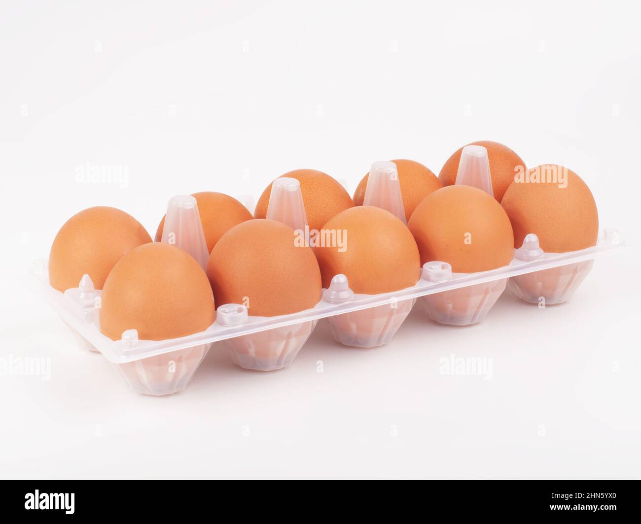 Fresh hen eggs in egg tray box on the white background Stock Photo - Alamy
