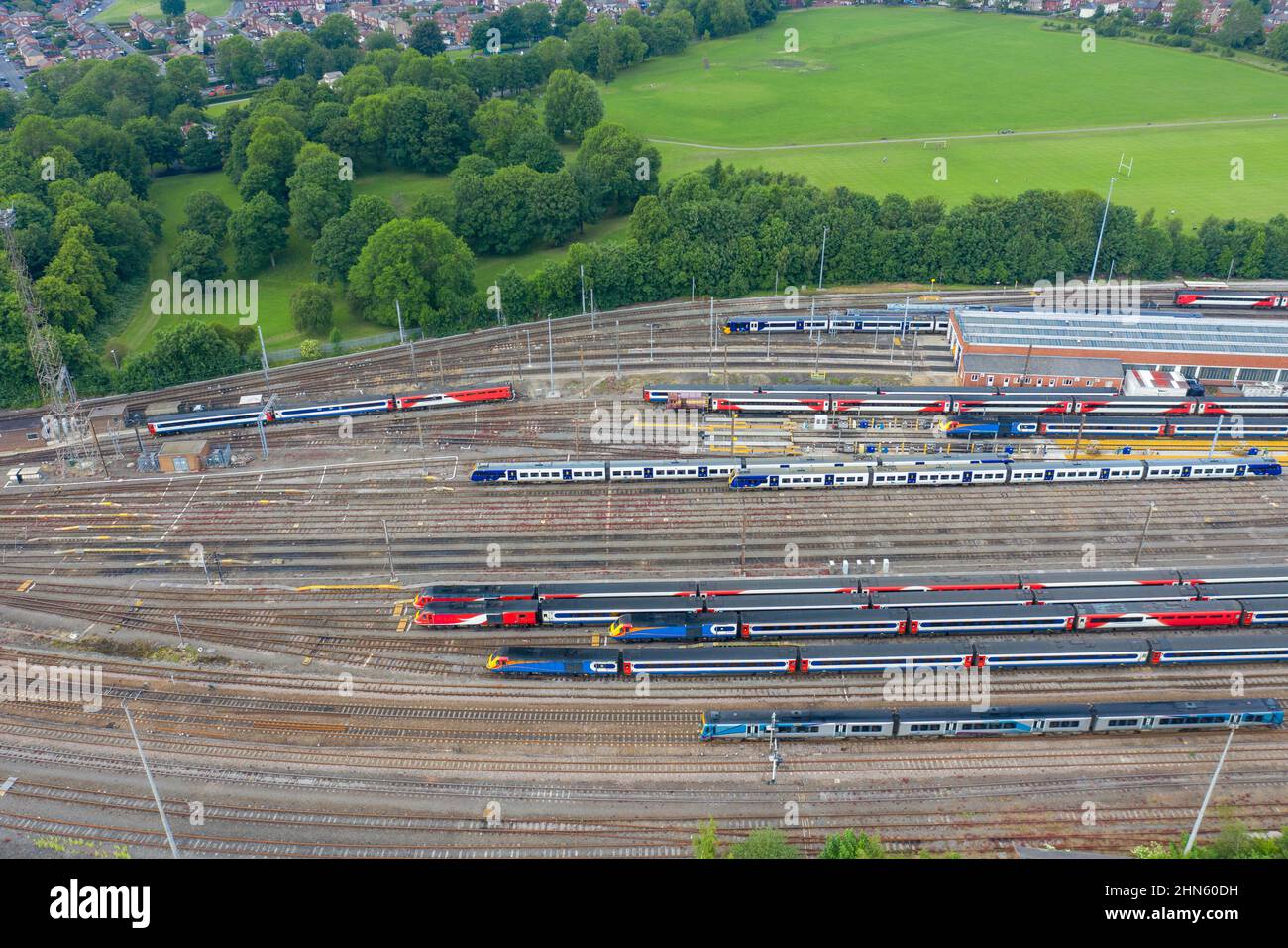 Aerial Photo of a train station works depot with lots of trains in the ...