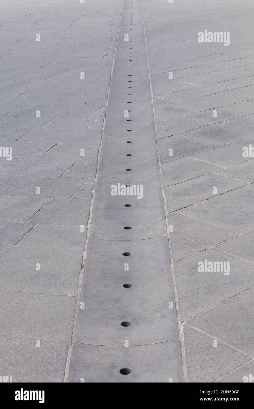 Long series of stone tiles for the drainage of rainwater in an Italian ...