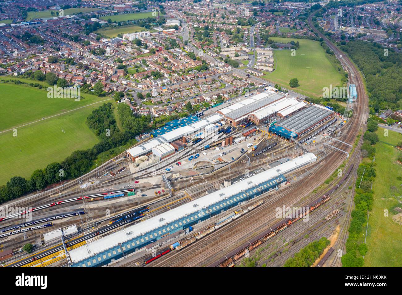Aerial Photo of a train station works depot with lots of trains in the ...