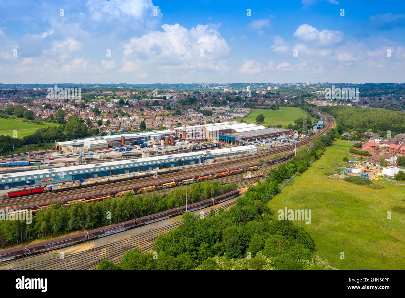 Aerial Photo of a train station works depot with lots of trains in the ...