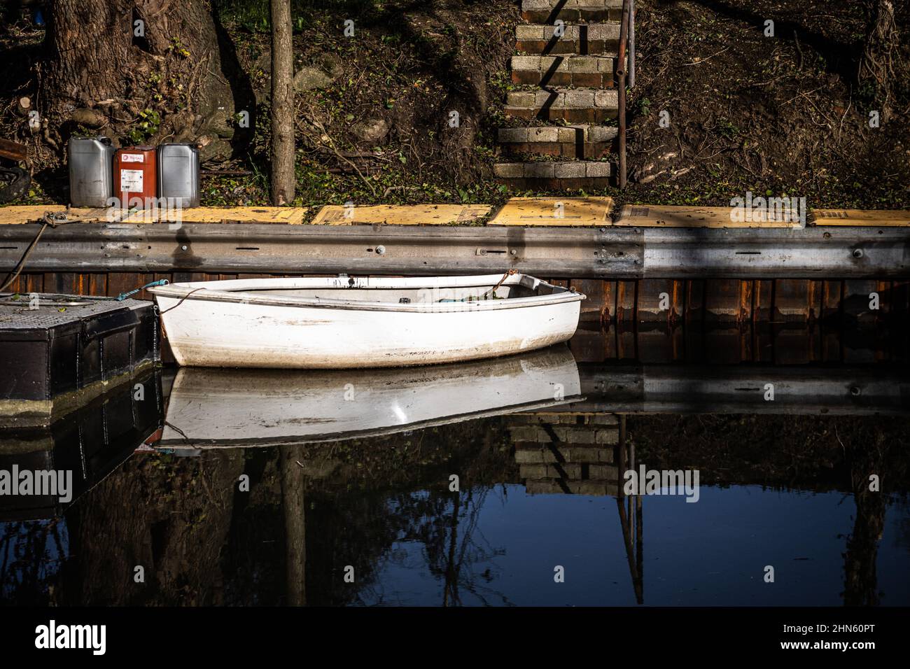 White rowing boat on a canal, Stroud, England Stock Photo - Alamy