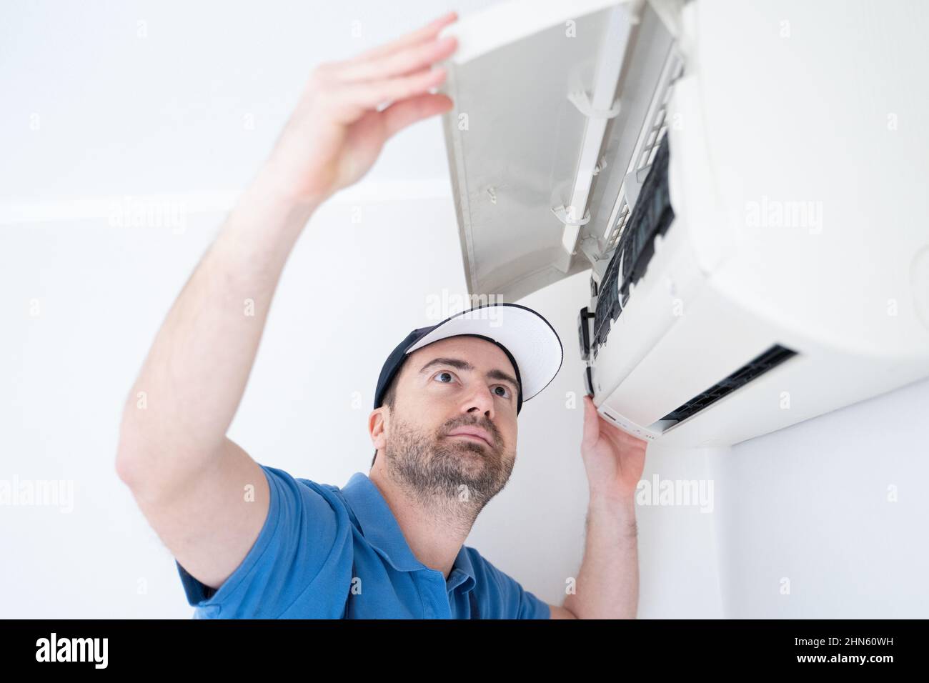 Technician installing hi-res stock photography and images - Alamy
