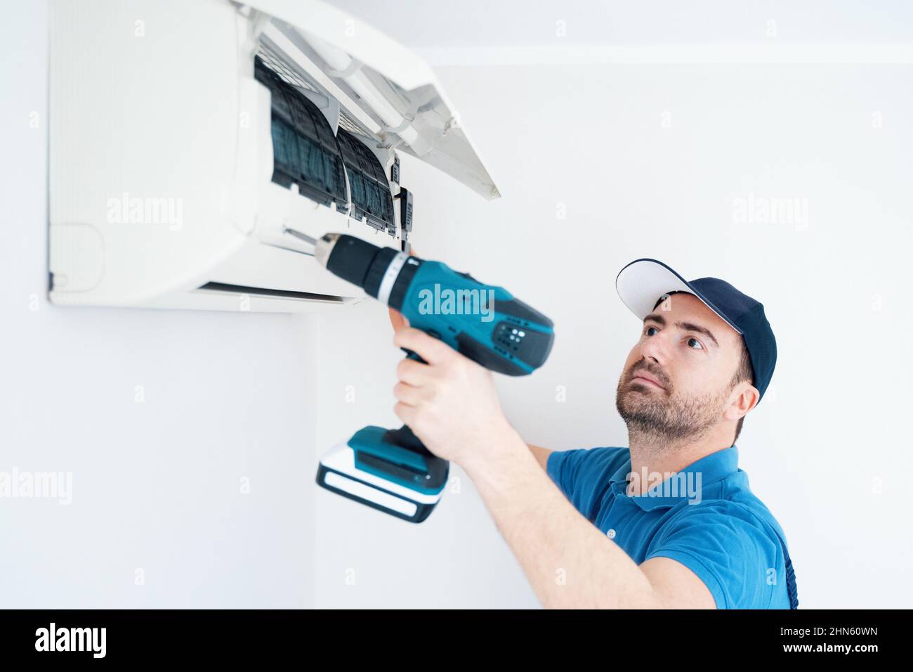 Technician installing hi-res stock photography and images - Alamy