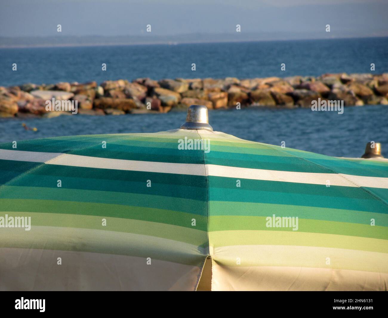 Beach umbrella on sea background Stock Photo - Alamy