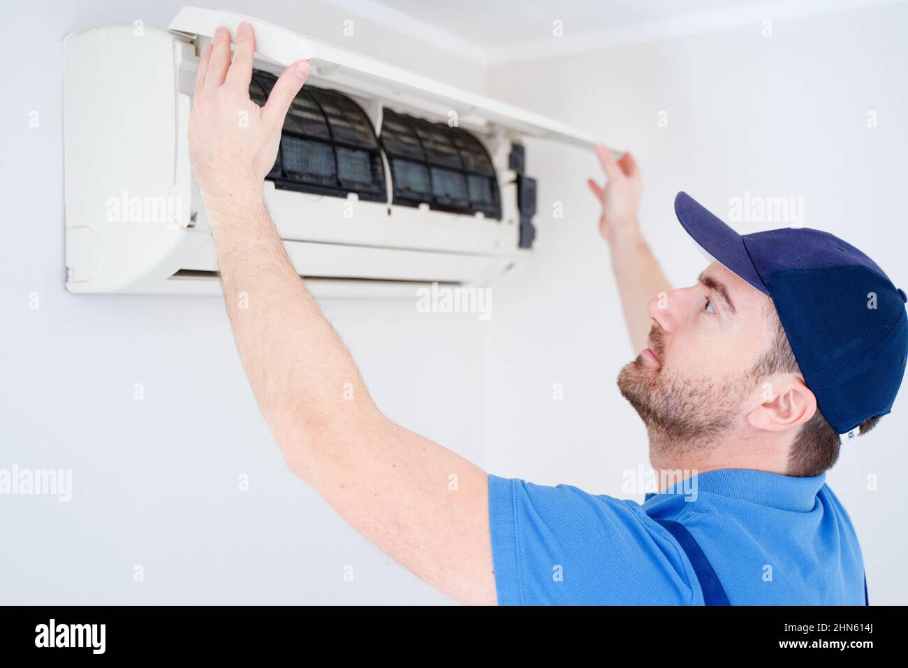 Technician installing hi-res stock photography and images - Alamy