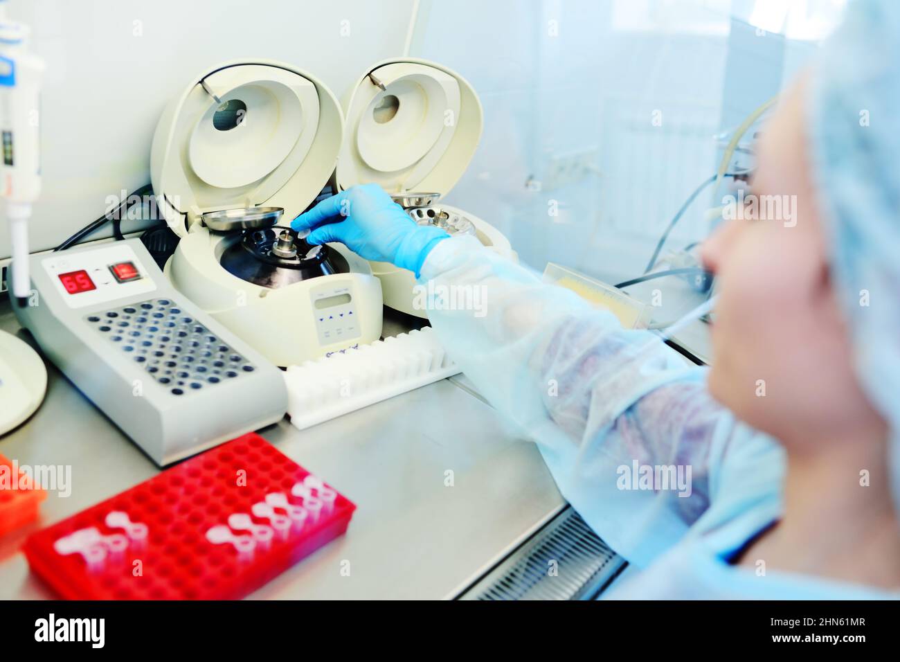 female scientist makes PCR DNA tests in a modern chemical and ...