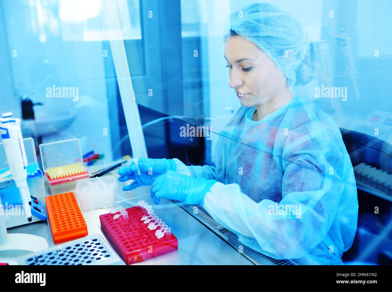 female scientist makes PCR DNA tests in a modern chemical and ...