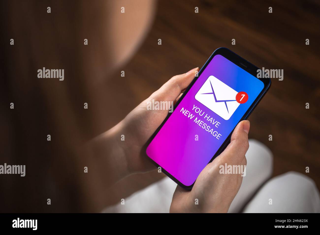 Woman hands holding smartphone with new message concept on screen. New ...
