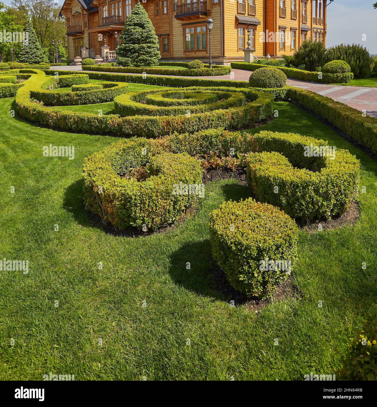 Beautiful summer garden with a walkway winding its way through Stock ...