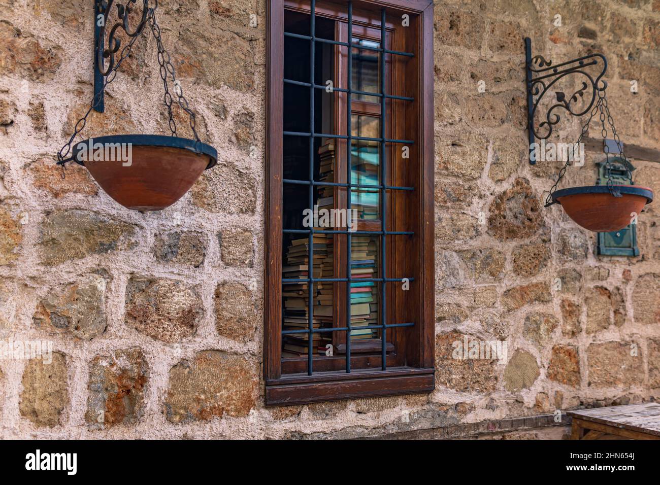 open window of a library with visible books in an ancient building ...