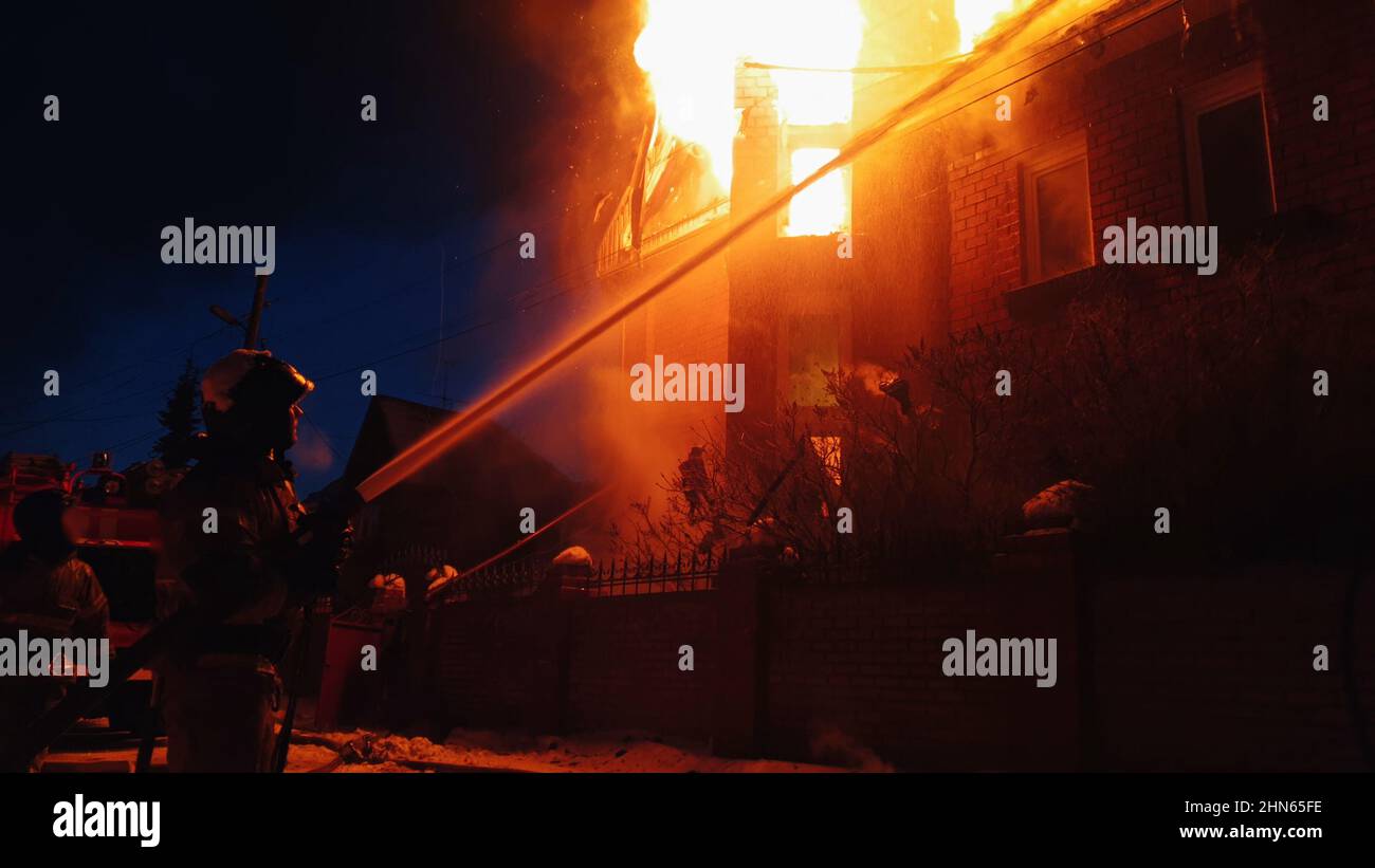 The roof of the house is on fire. The residential building burn ...