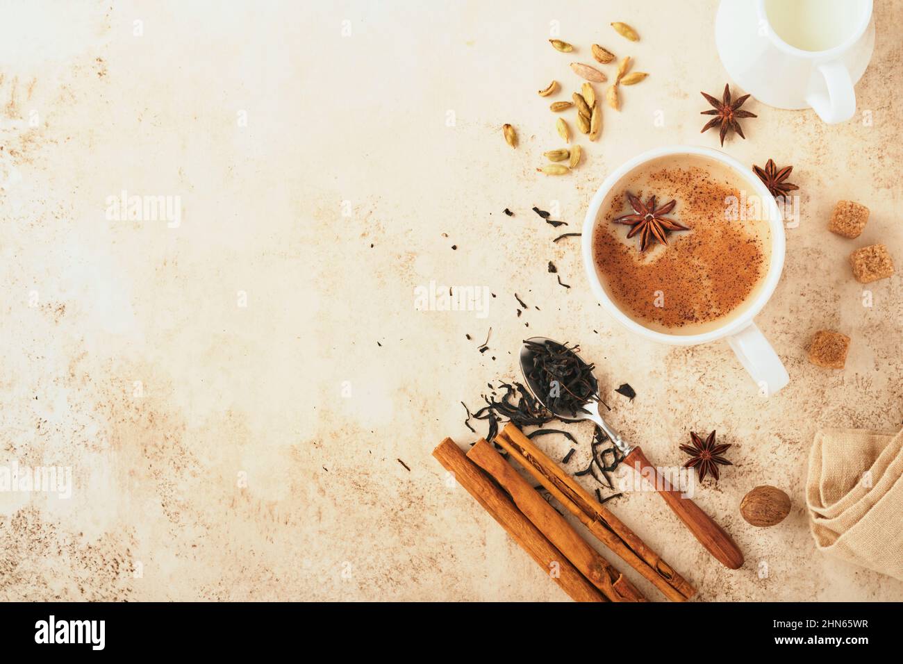 Masala tea. Masala chai spiced tea with milk and spices on light warm ...