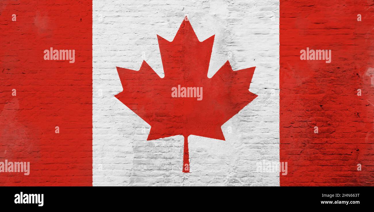 Full frame photo of a weathered flag of Canada painted on a plastered ...