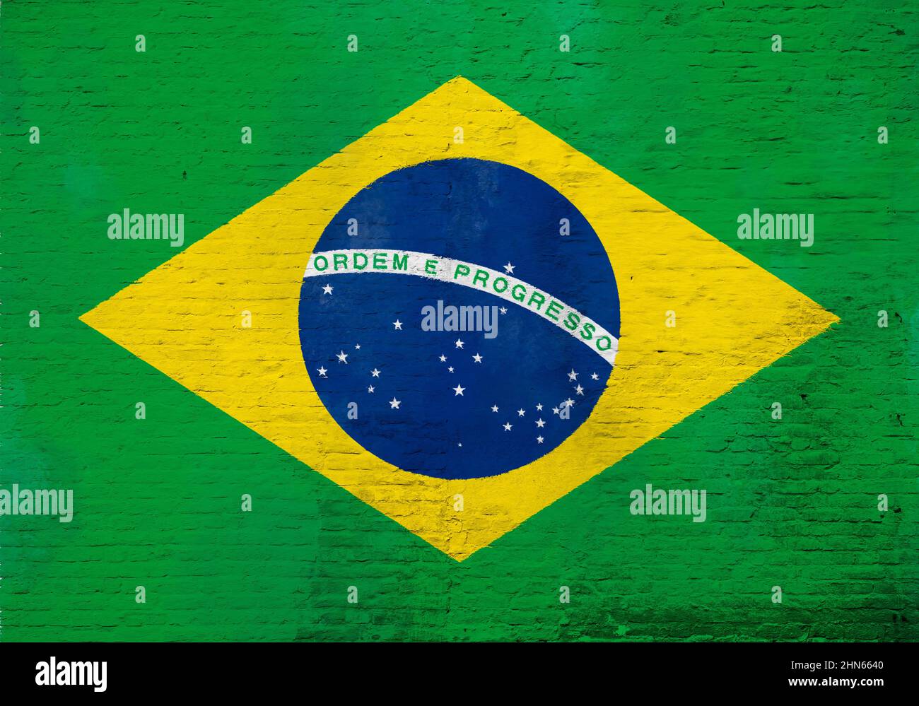 Full frame photo of a weathered flag of Brazil painted on a plastered ...