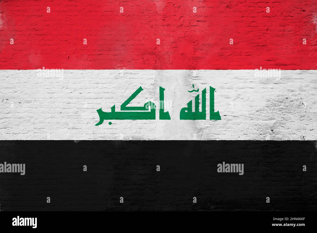 Full frame photo of a weathered flag of Iraq painted on a plastered ...